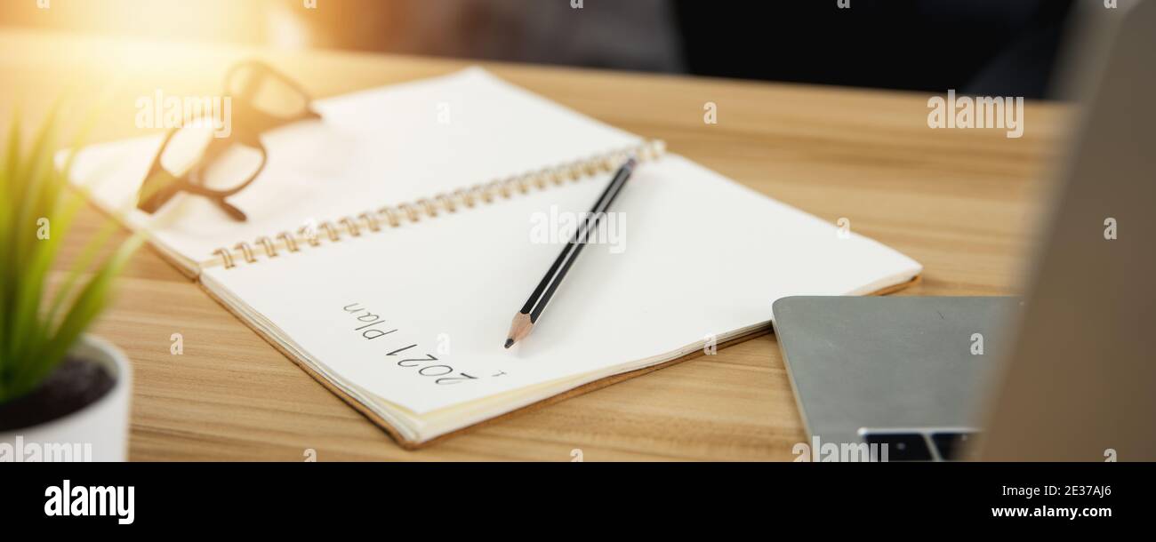Close up 2021 plan on paper of notebook laying on table, plan and how ...