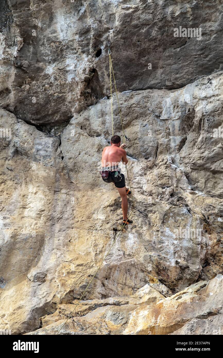Top rope climbing rocks or top roping, anchor system at the top of the ...