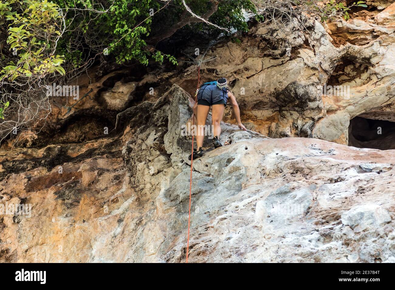 Mountain climber climbing at top alpine rock education and training ...