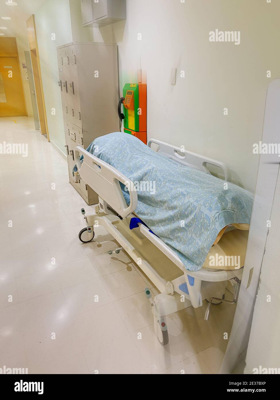 Body on hospital bed in the hospital hall Stock Photo - Alamy