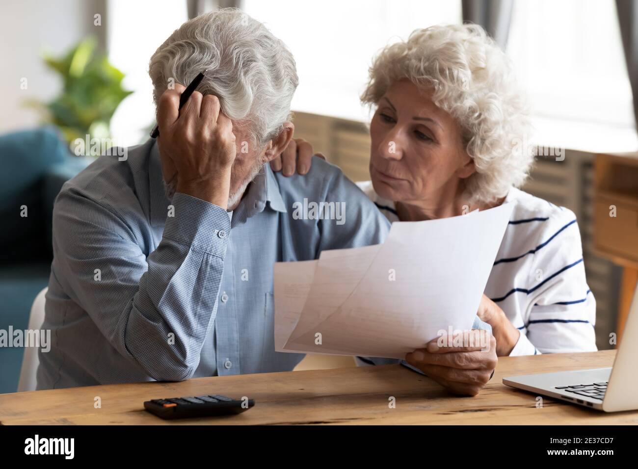 Worried middle aged couple having financial problems Stock Photo - Alamy