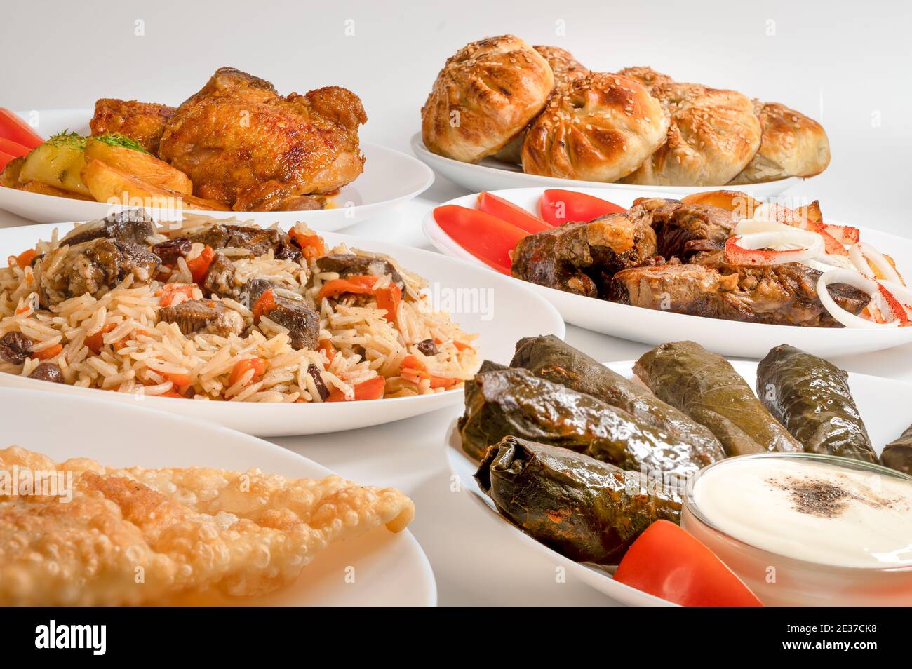 Kazan kabob, Plov, Dolma and fried chicken. Uzbek Main dishes on white ...