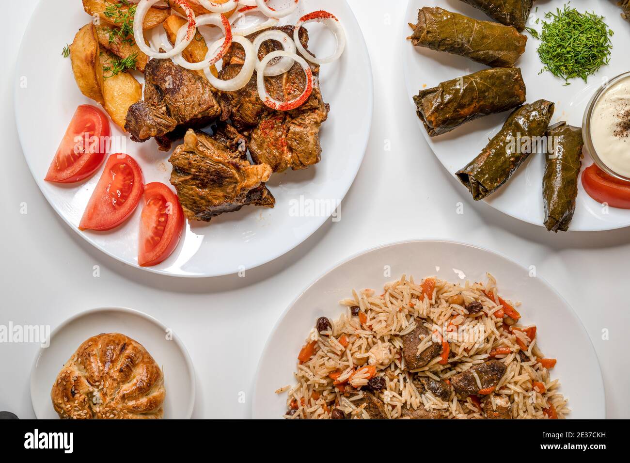 Top view of Kazan kabob, Plov, Dolma and fried chicken. Uzbek Main ...