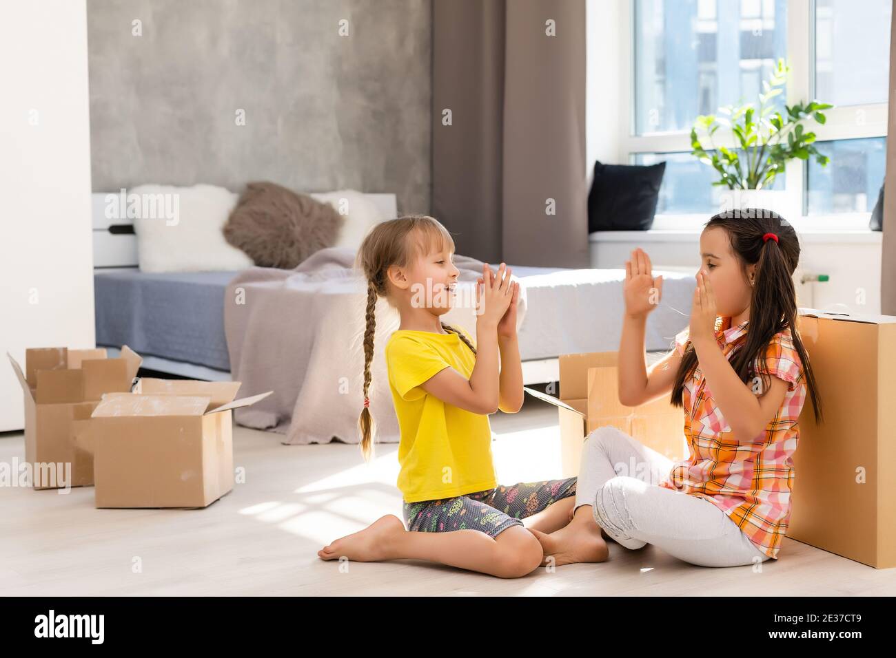 Two children entering living room hi-res stock photography and images ...