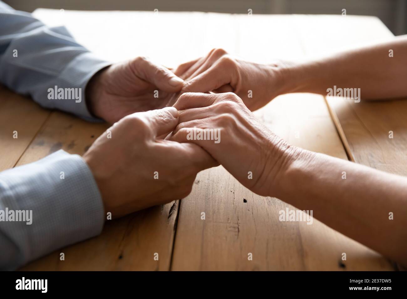 Compassionate middle aged husband soothing comforting mature wife Stock ... Compassionate middle aged husband soothing comforting mature wife Stock ...