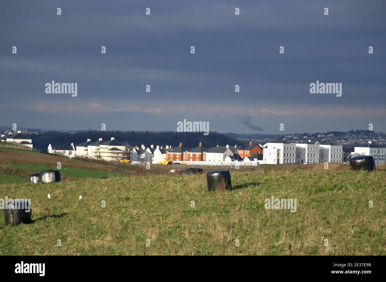 A view over farm fields to Sherford, the new town being constructed on ...
