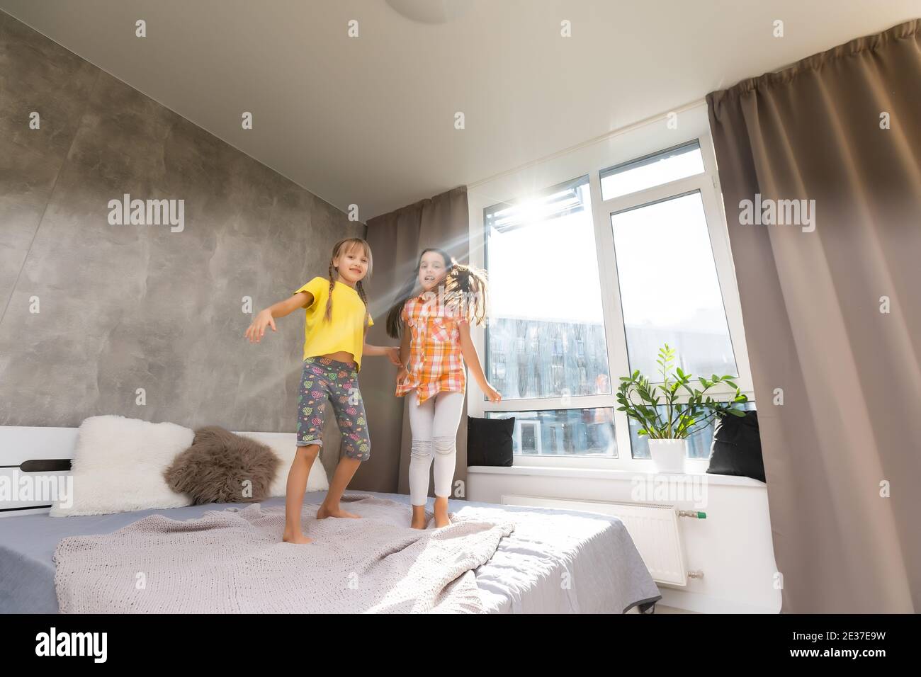 Creative cute girls, two sisters at home Stock Photo - Alamy