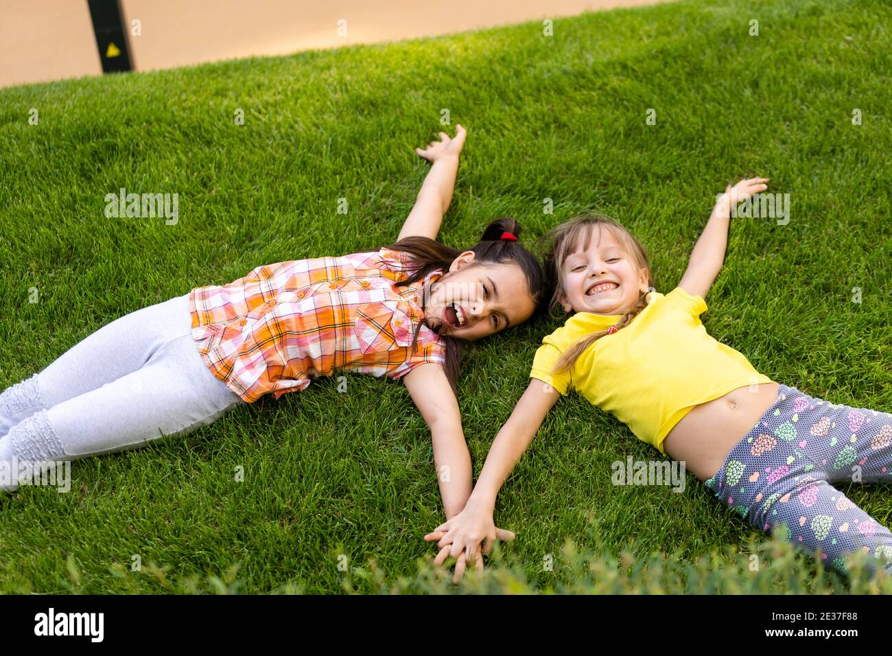 happy excited kids having fun together on playground Stock Photo - Alamy