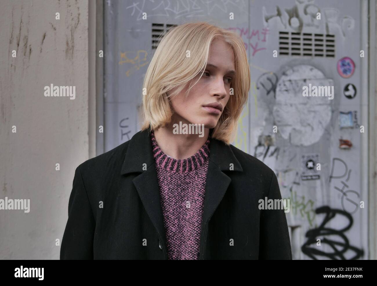Model posing for photographers in the street after Etro fashion show ...