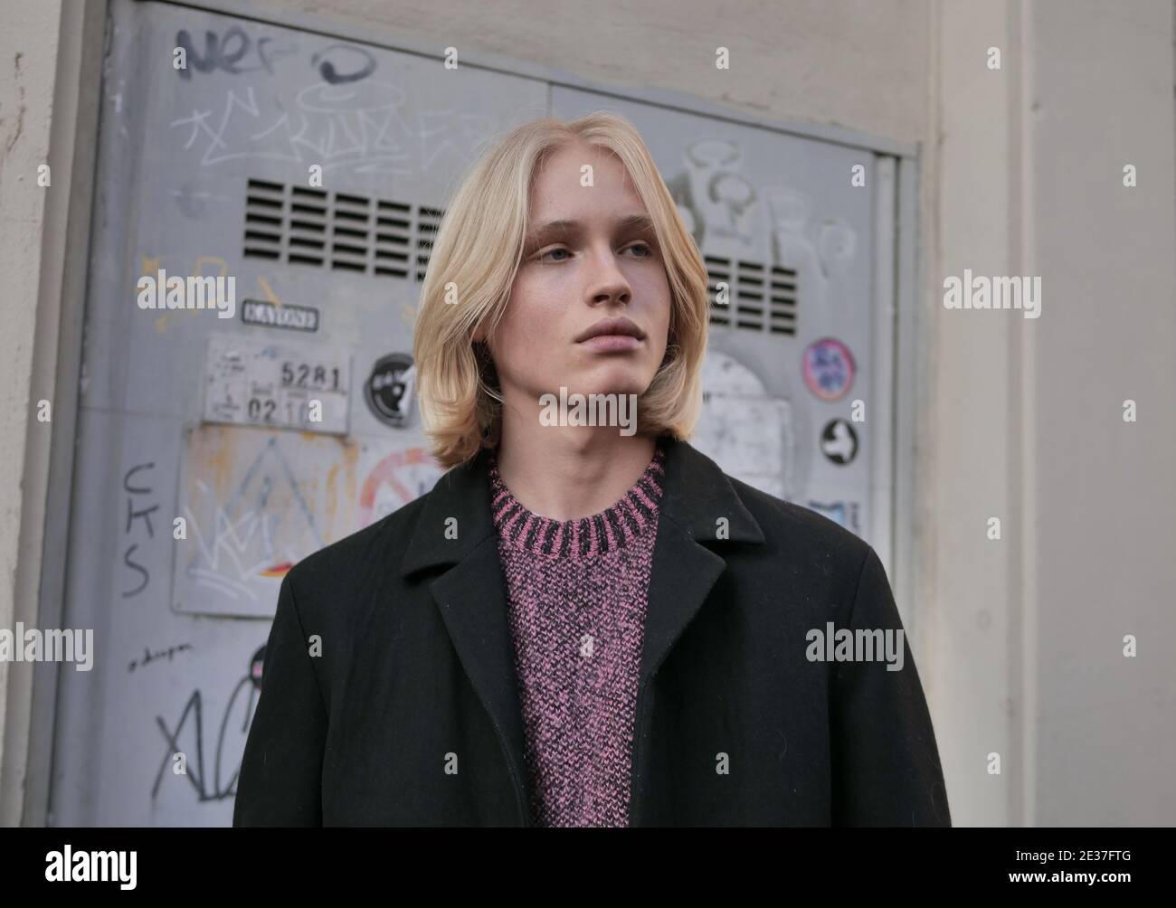 Model posing for photographers in the street after Etro fashion show ...
