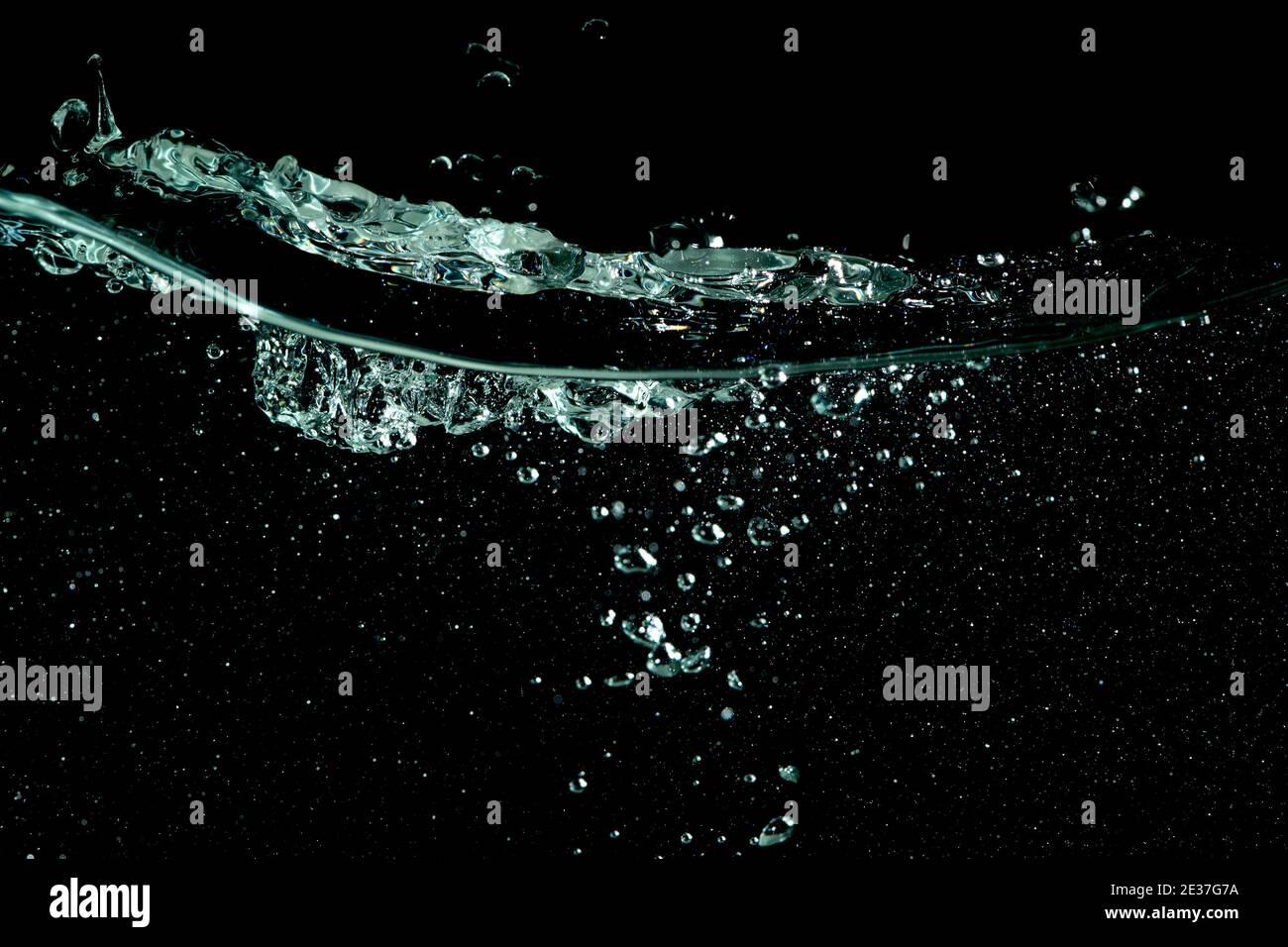 Water splash wave with black background Stock Photo - Alamy