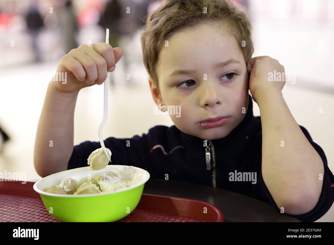 Child thinking about eating food hi-res stock photography and images ...