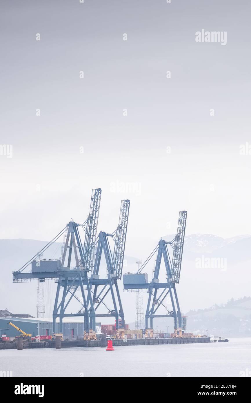 Cranes at logistics port terminal for offloading containers Stock Photo ...