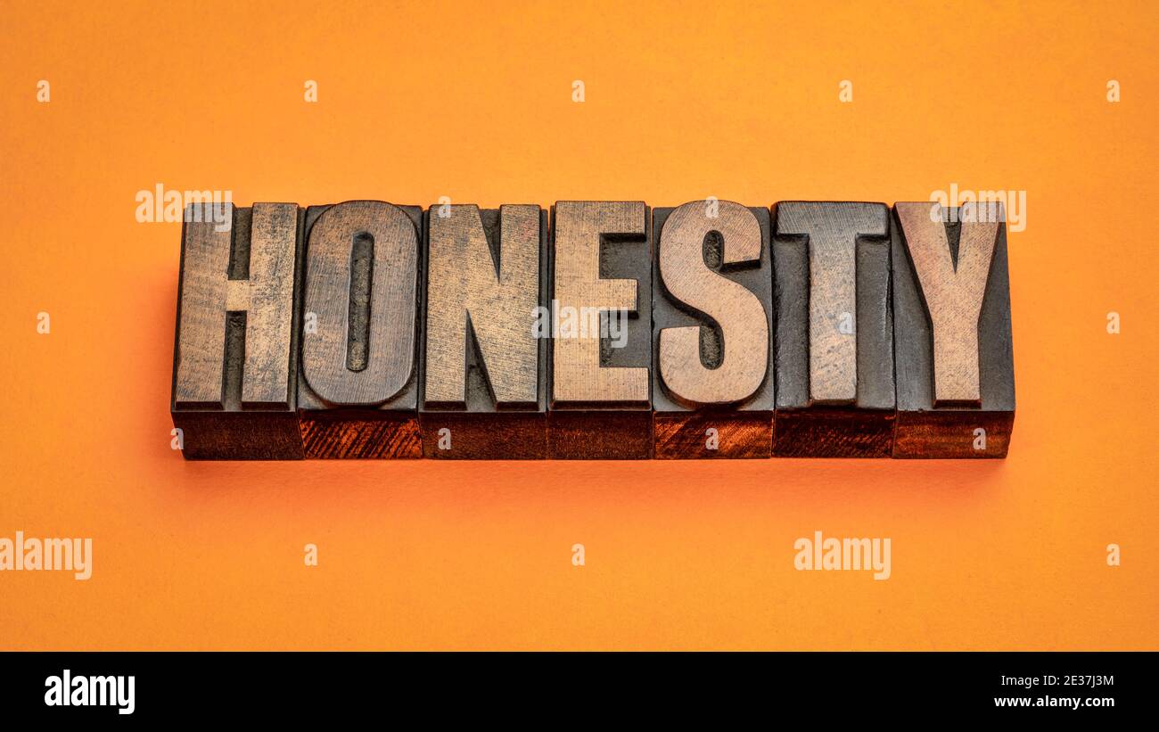 honesty word abstract in vintage letterpress wood type against orange ...