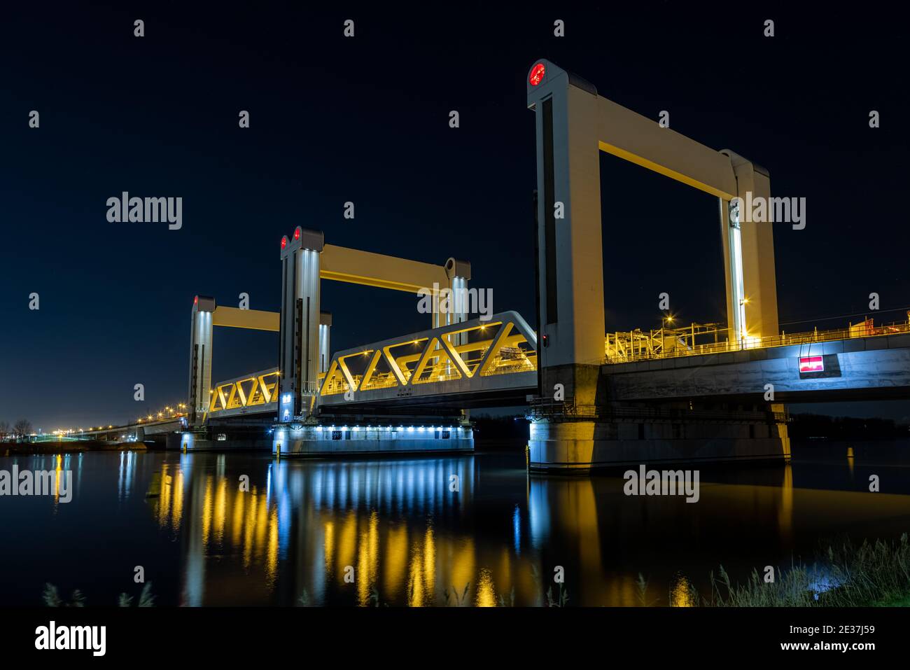 Botlek bridge at night. A Modern vertical lift bridge over the river ...