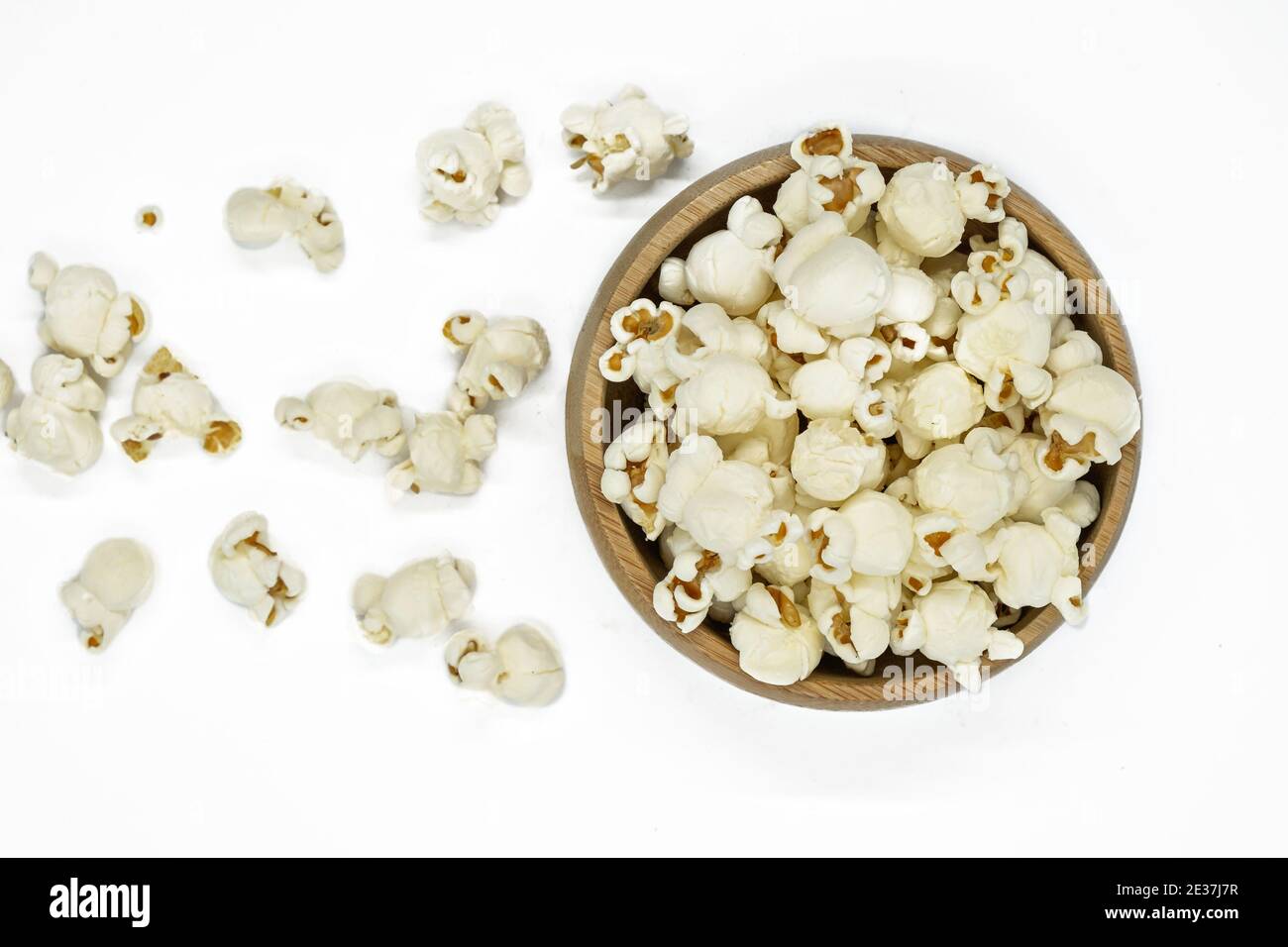 pop corn in wooden bowl with spoon isolated on a white background Stock ...