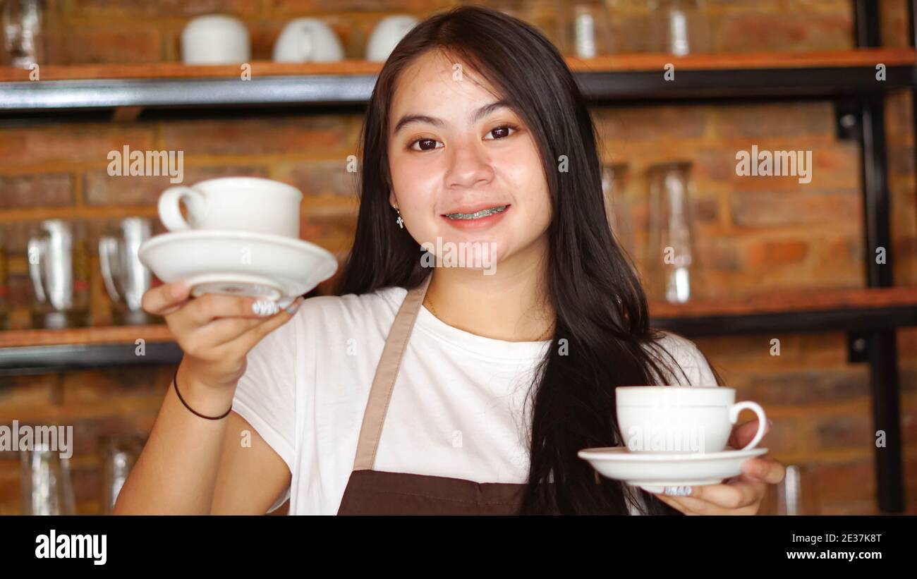 Beautiful asian female barista hi-res stock photography and images - Alamy