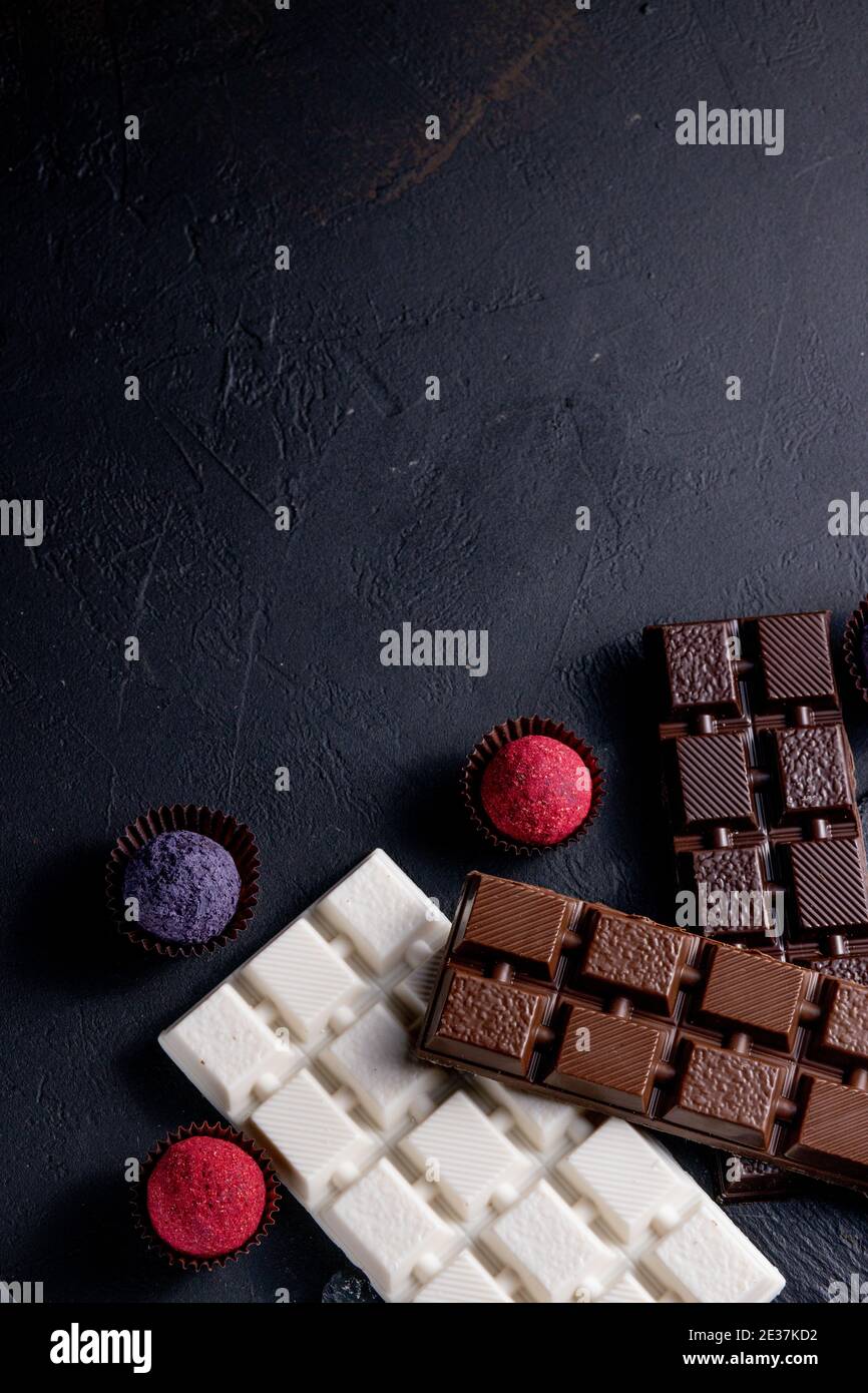 Three types of chocolate - black, milk and white with luxury handmade ...