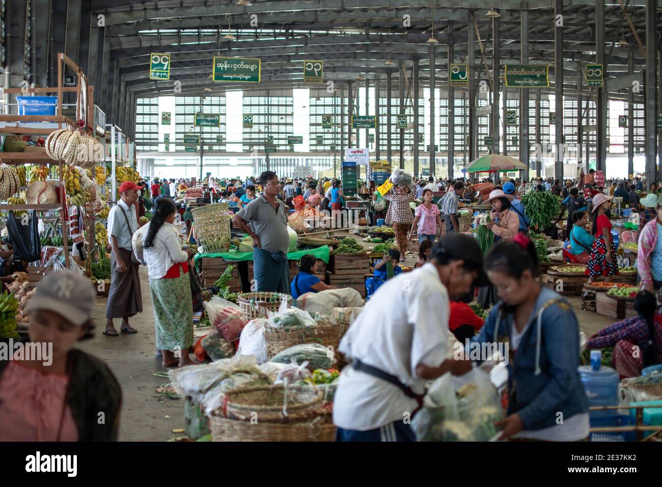 Burmese people visiting a local fruit and vegetables market to buy and ...