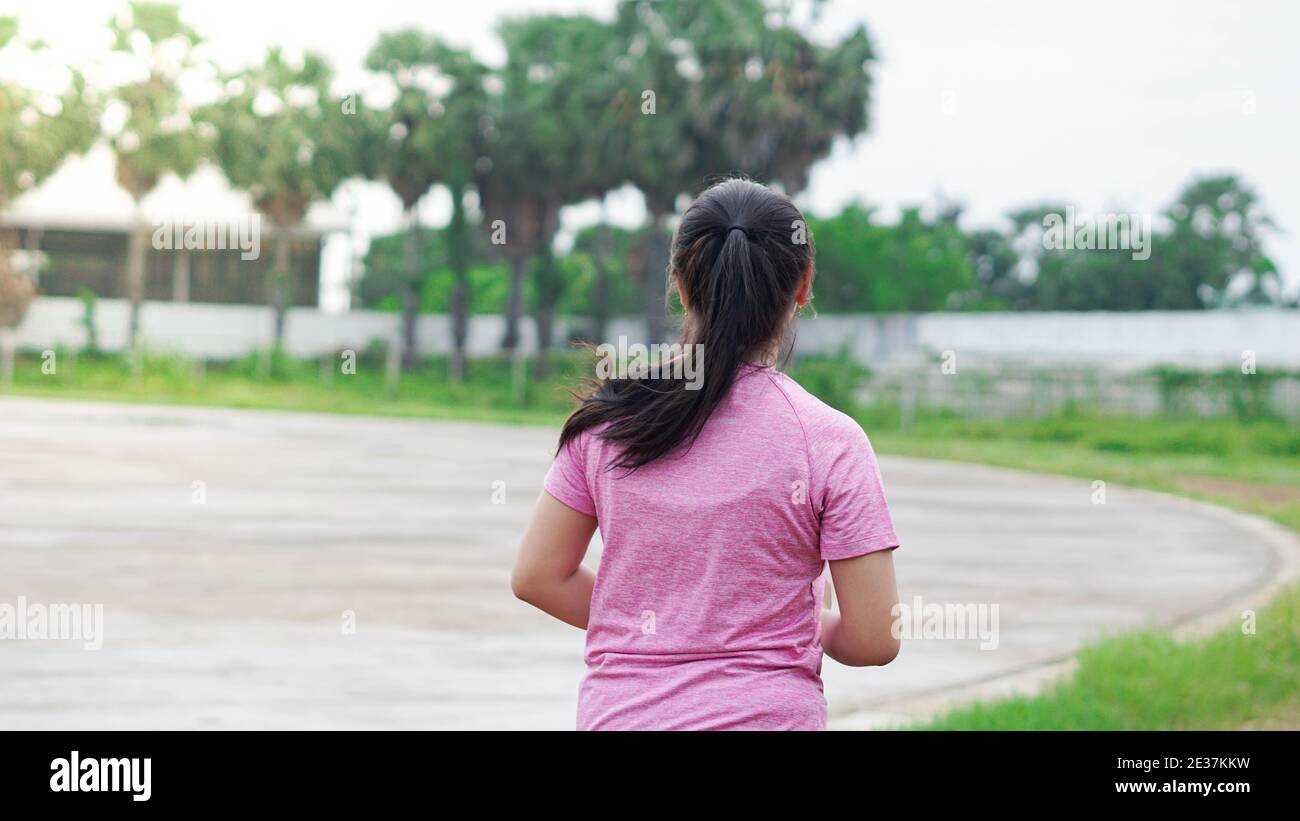 asian woman athlete running on track. back view Stock Photo - Alamy