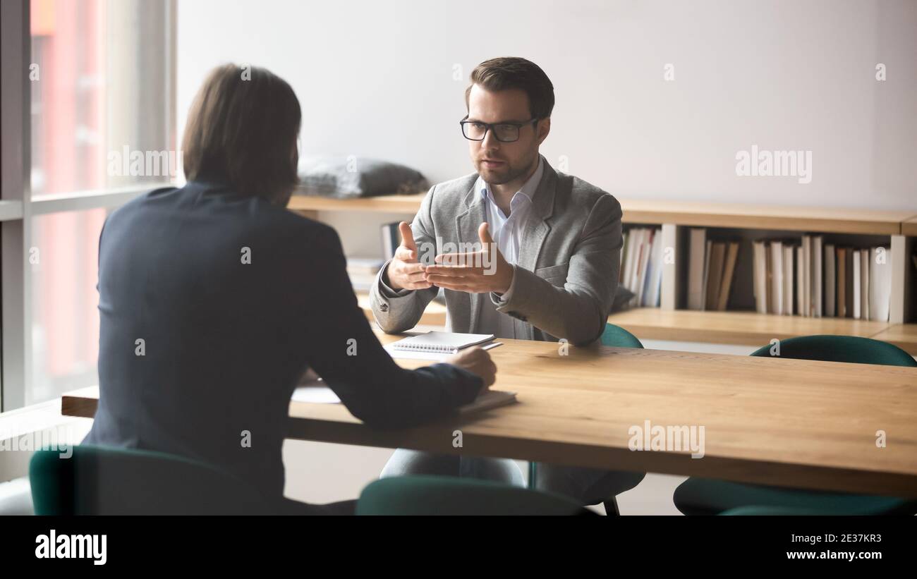 Two successful male partners negotiation project ideas in boardroom ...