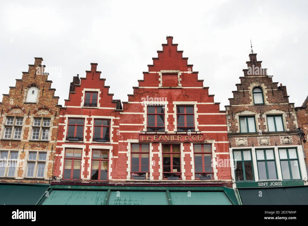 Famous old colorful buildings at Market square in Bruges, Belgium ...
