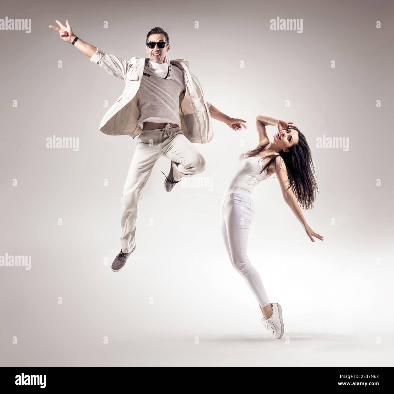 Talented couple dancing in a bright studio - isolated Stock Photo - Alamy