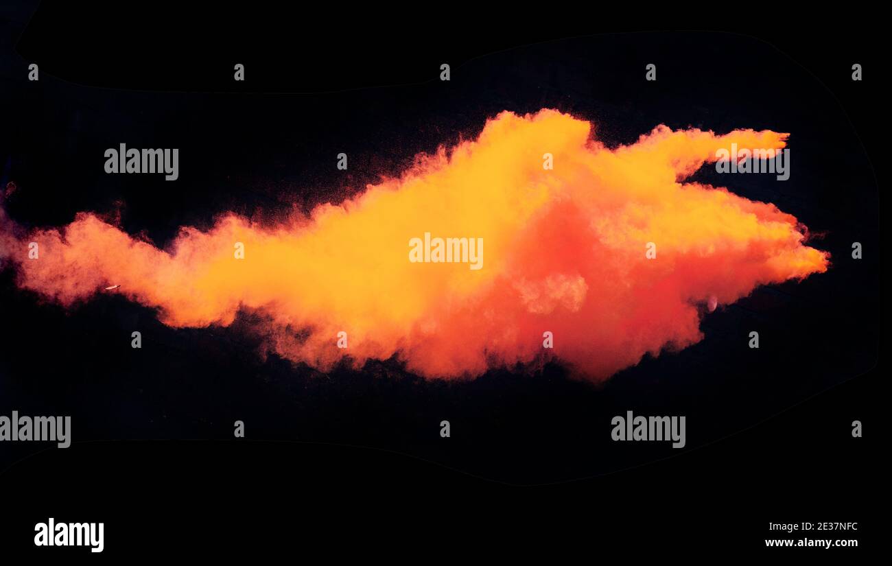 Orange fume rising on a black background Stock Photo - Alamy