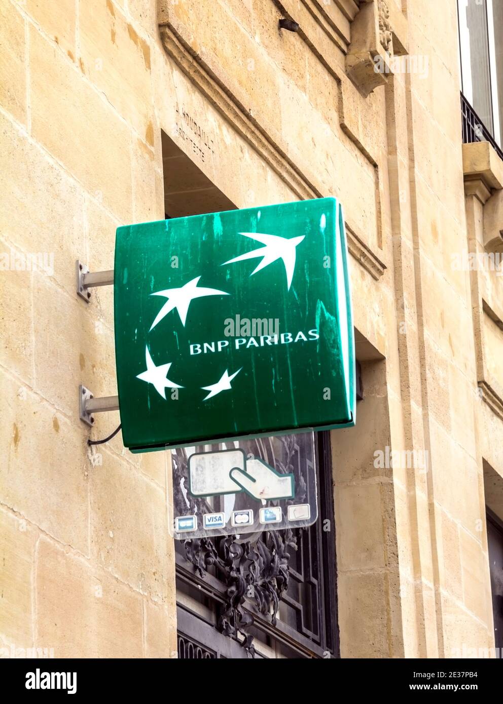 Sign outside a branch of the BNP Paribas Bank. Formed through merger in ...