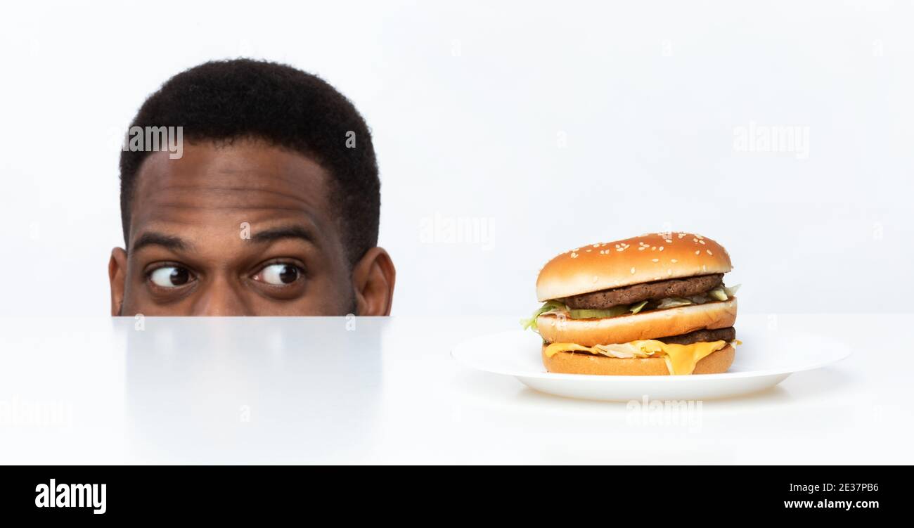 Hungry African American Man Looking At Burger, White Background ...