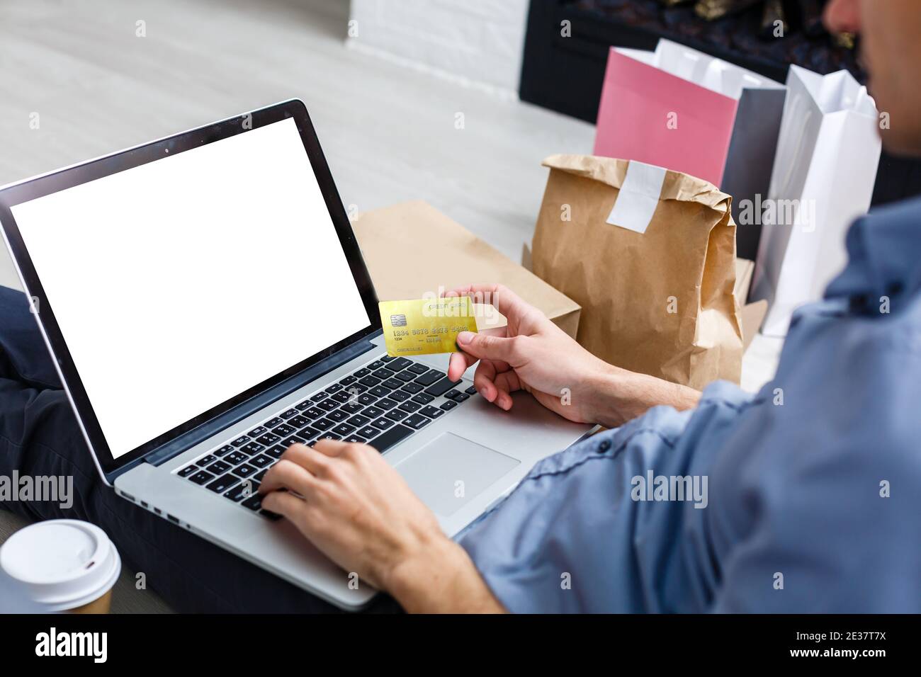 Back view of male person sitting front open laptop computer with blank ...