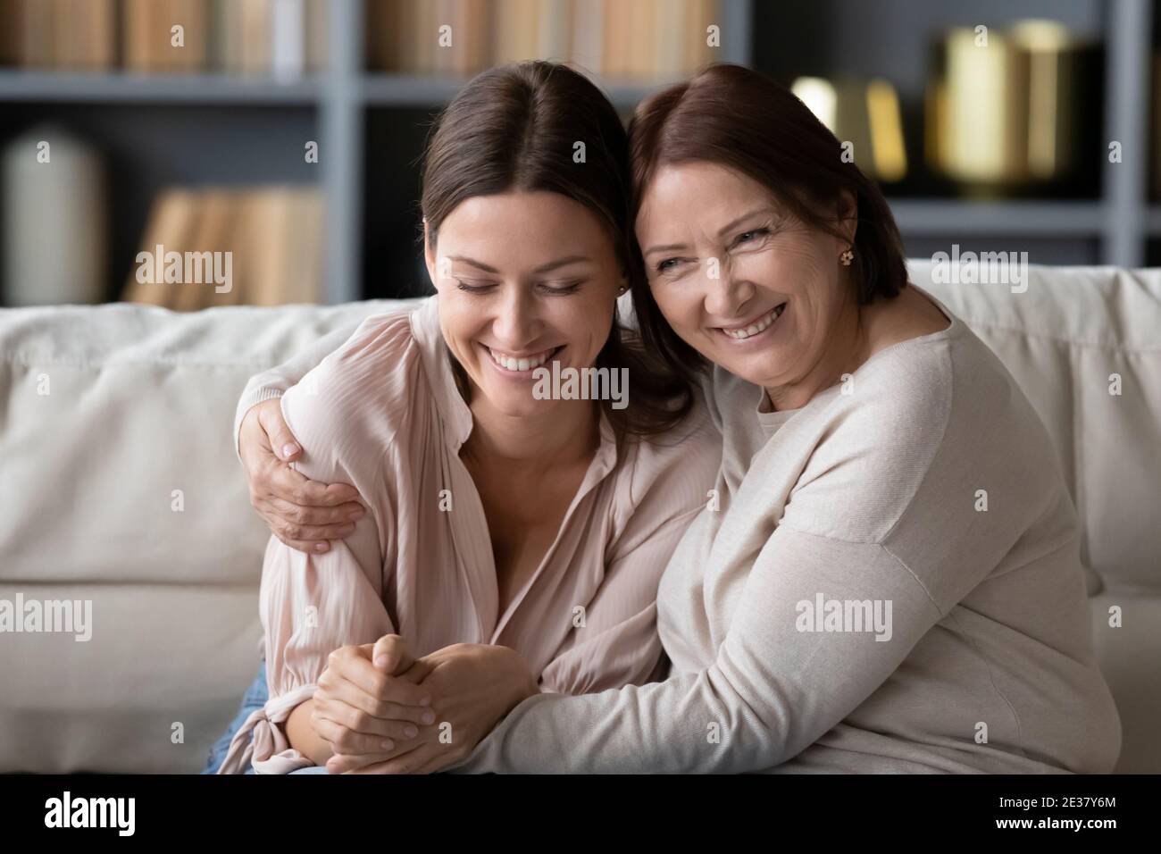 Close up smiling mature mother embracing grownup daughter, having fun Stock Photo - Alamy