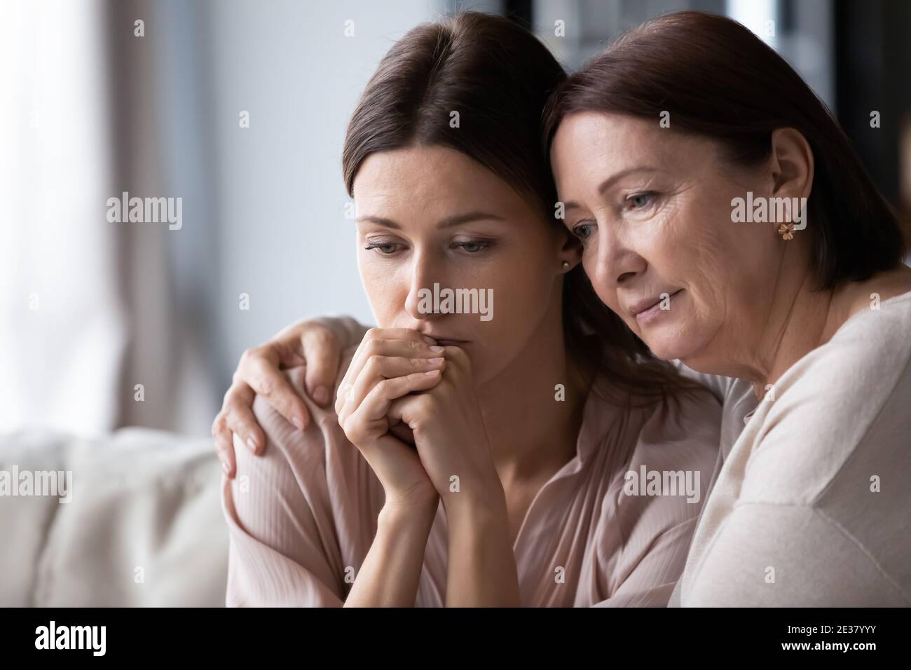 Close up loving mature mother calming frustrated grownup daughter Stock ...