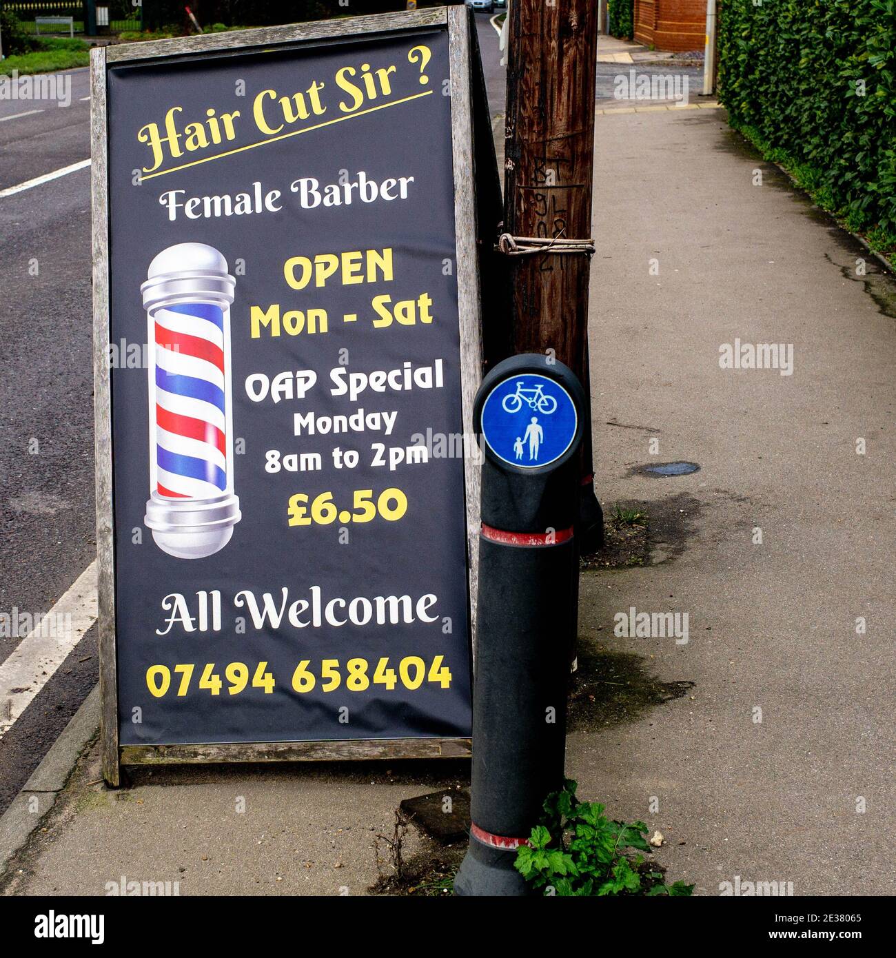Signage on the side of Hullbridge Road, advertising a female barber and ...