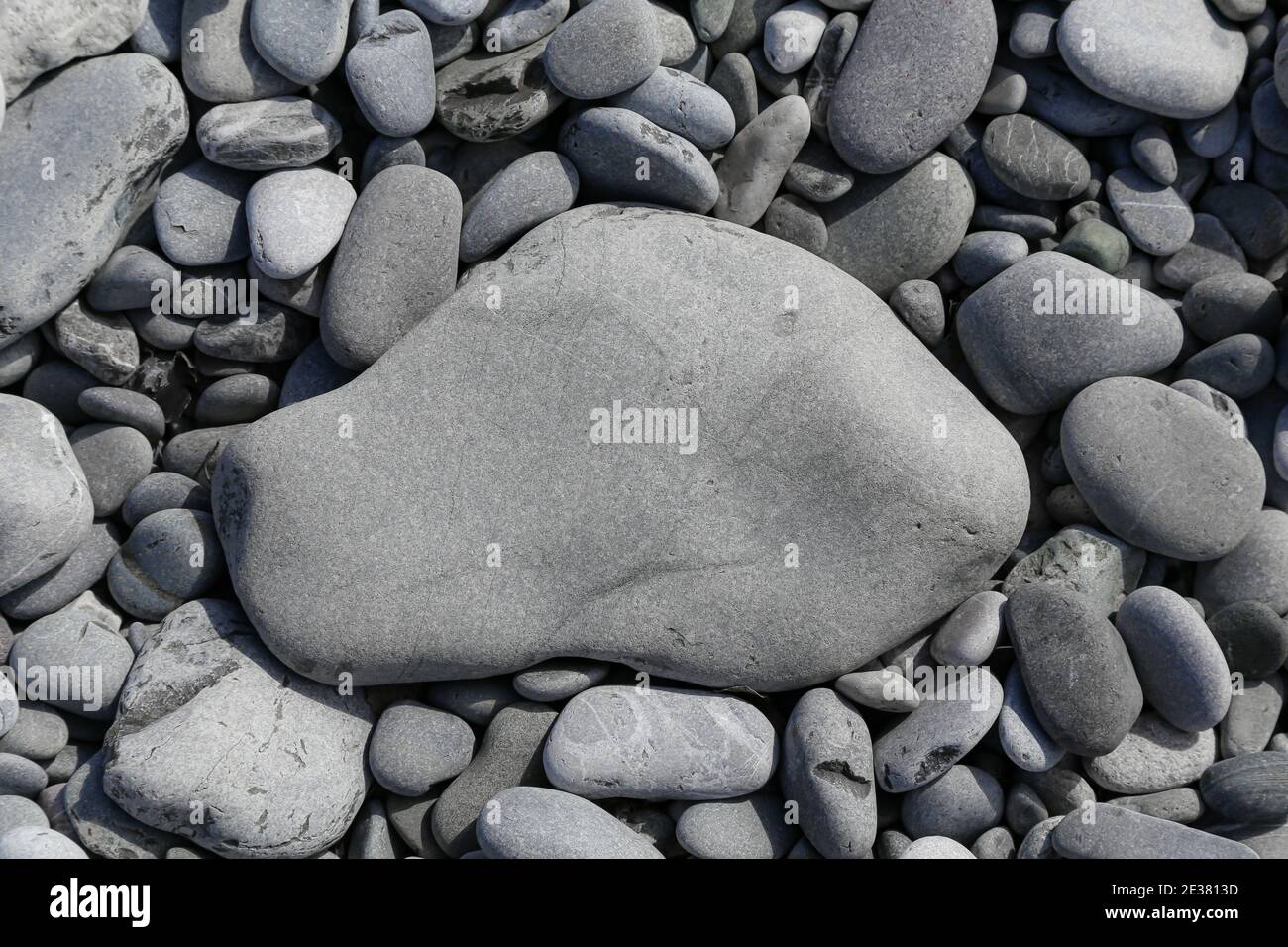 Light grey beach stones hi-res stock photography and images - Alamy