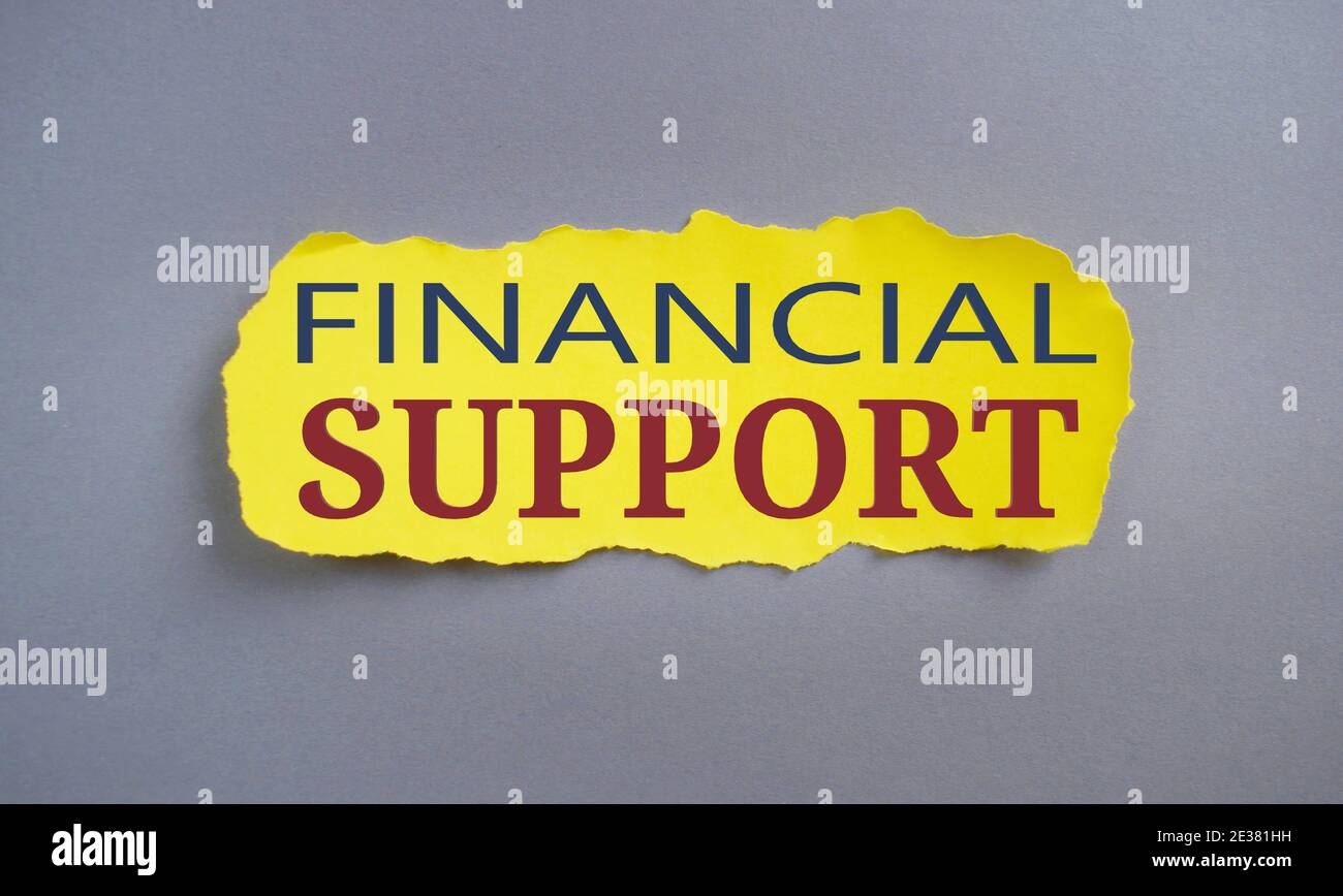 Financial support text written on yellow torn paper.Concept of ...