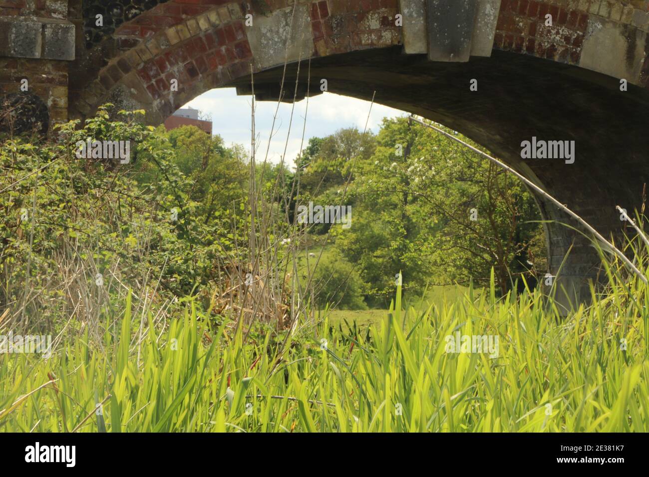 Solid brickwork of a bridge across a stream Stock Photo - Alamy