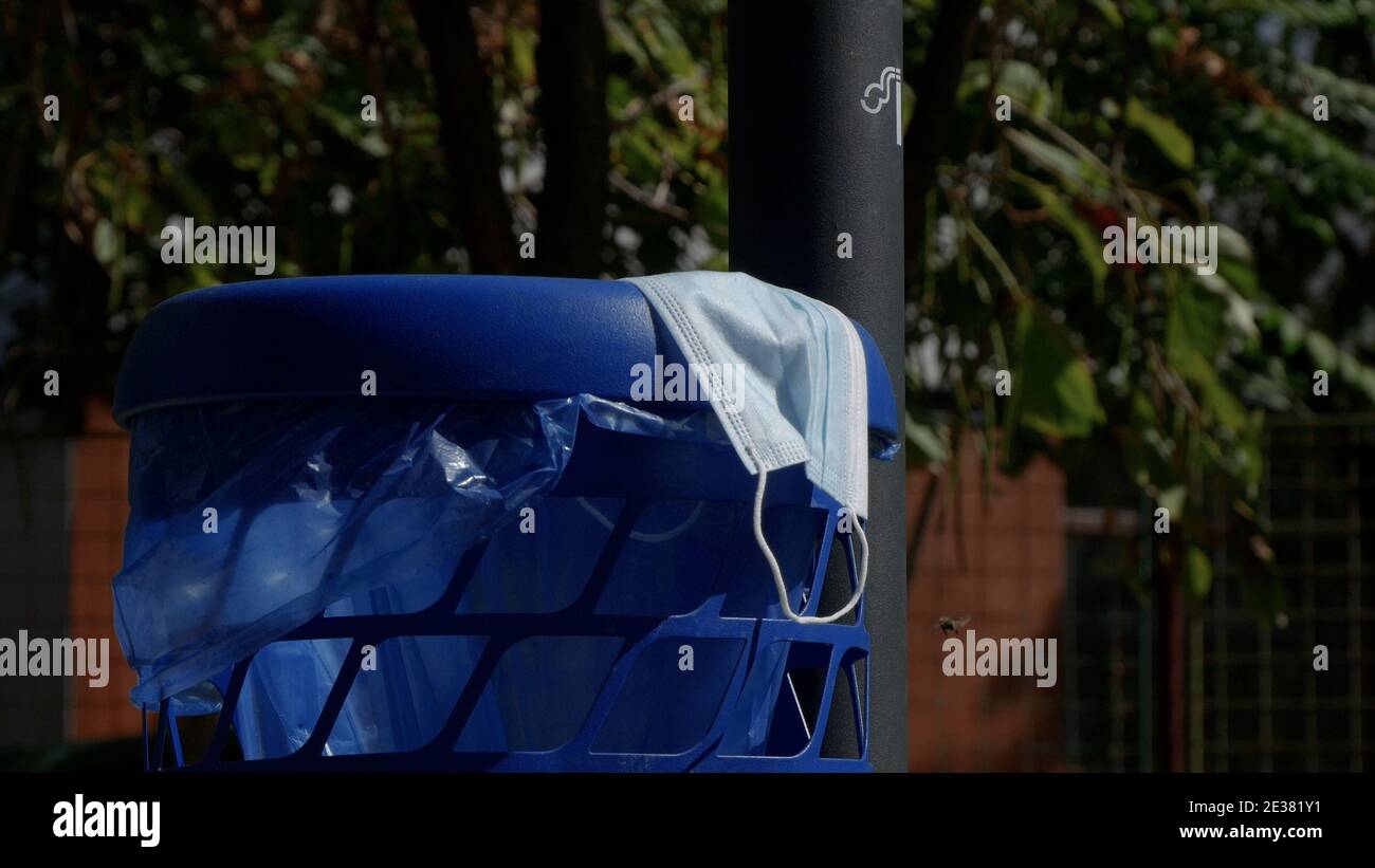 Used Medical Face Mask Thrown in a Trash Can on the Street, Dangerous ...
