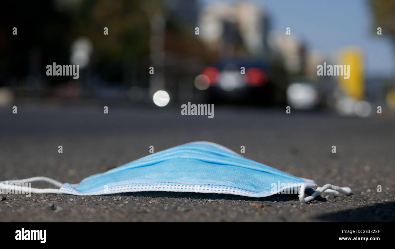 Medical Face Mask Used and Abandoned on the Street, Dangerous Garbage ...