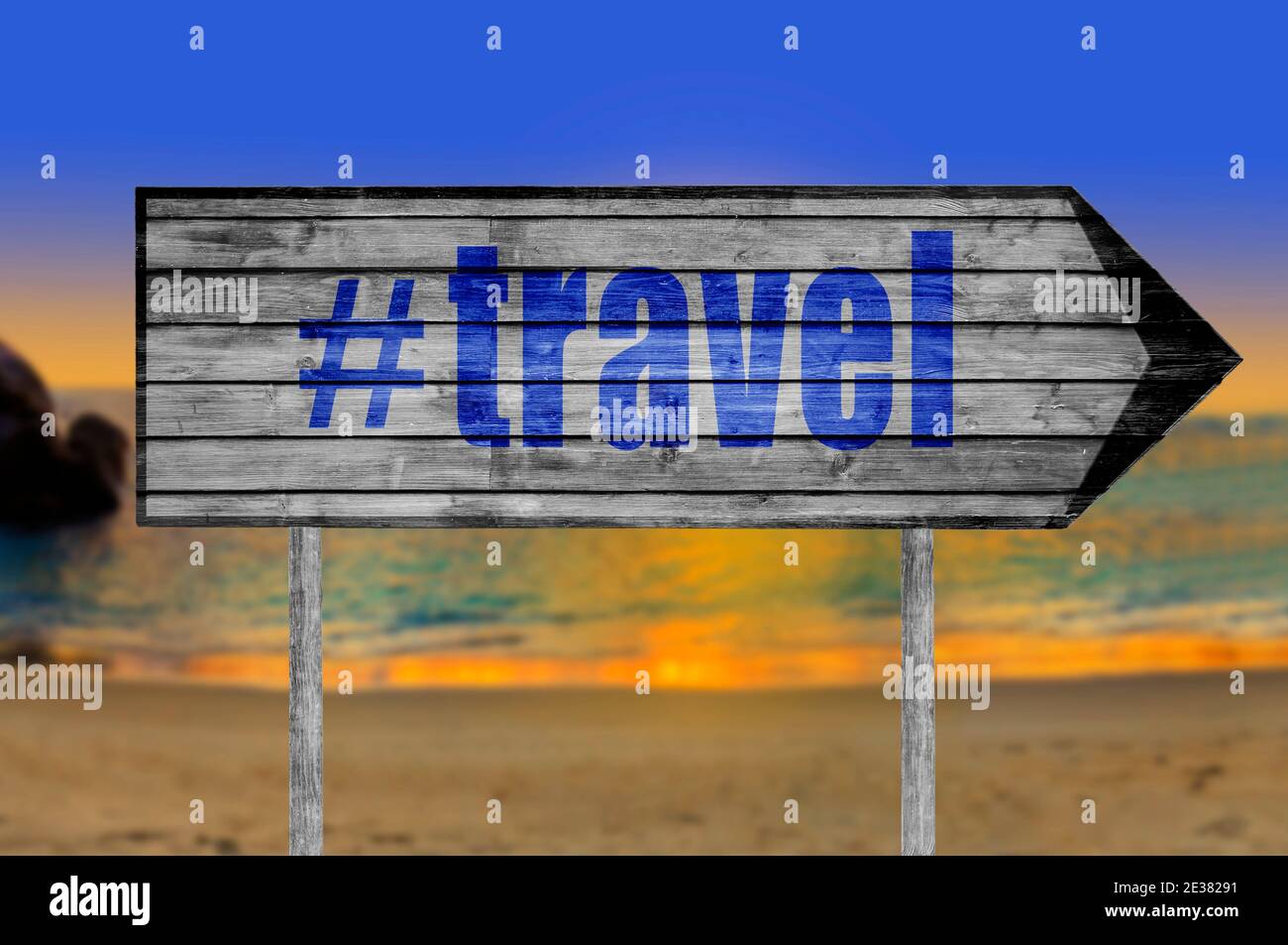The word with hashtag TRAVEL wooden sign with on a beach background ...