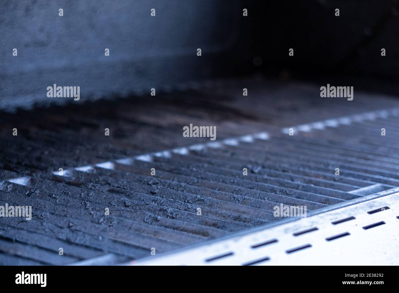Close up view of cast iron grill grates of an outdoor gas grill Stock ...
