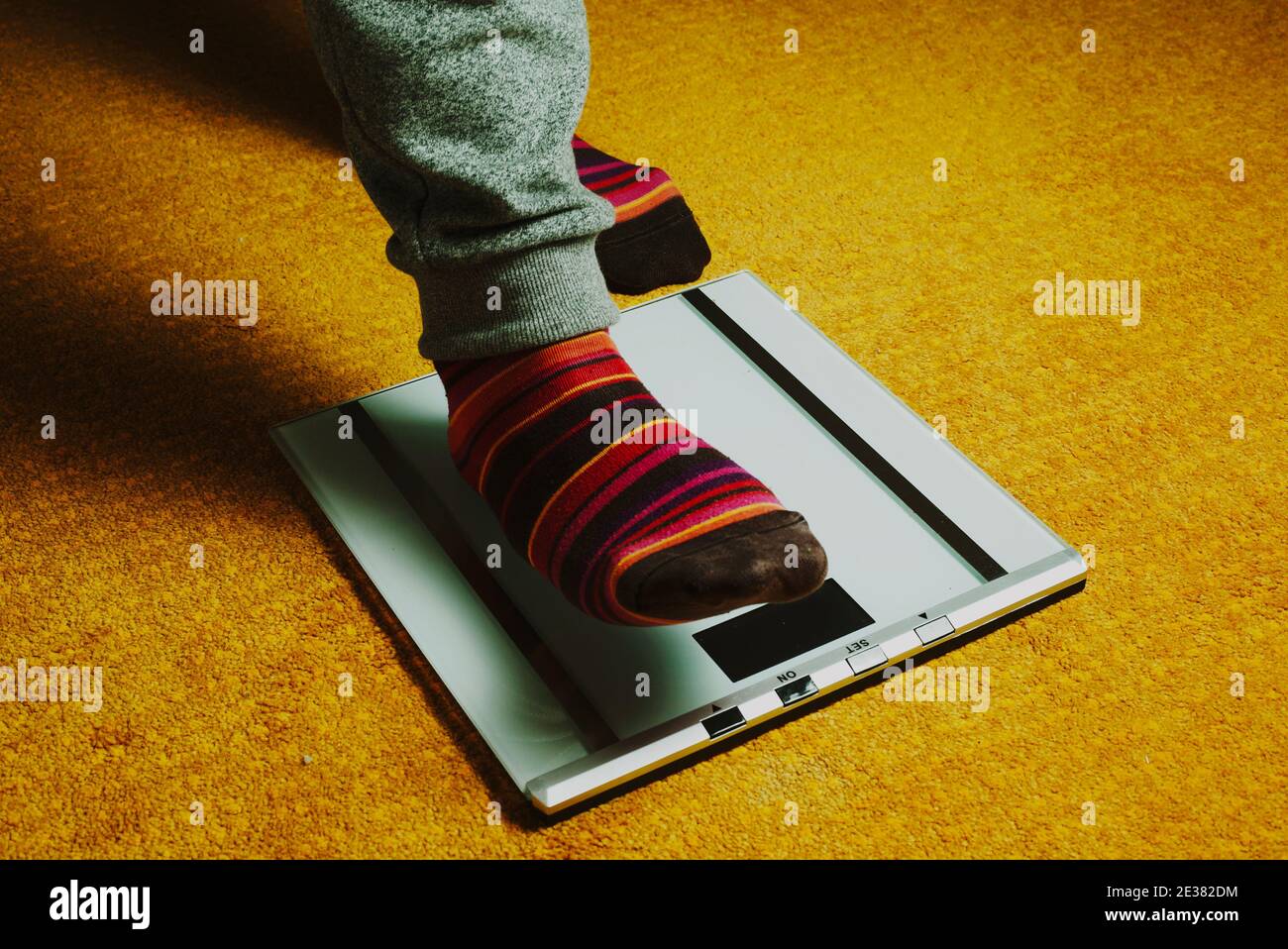 Man on scale feet socks hi-res stock photography and images - Alamy