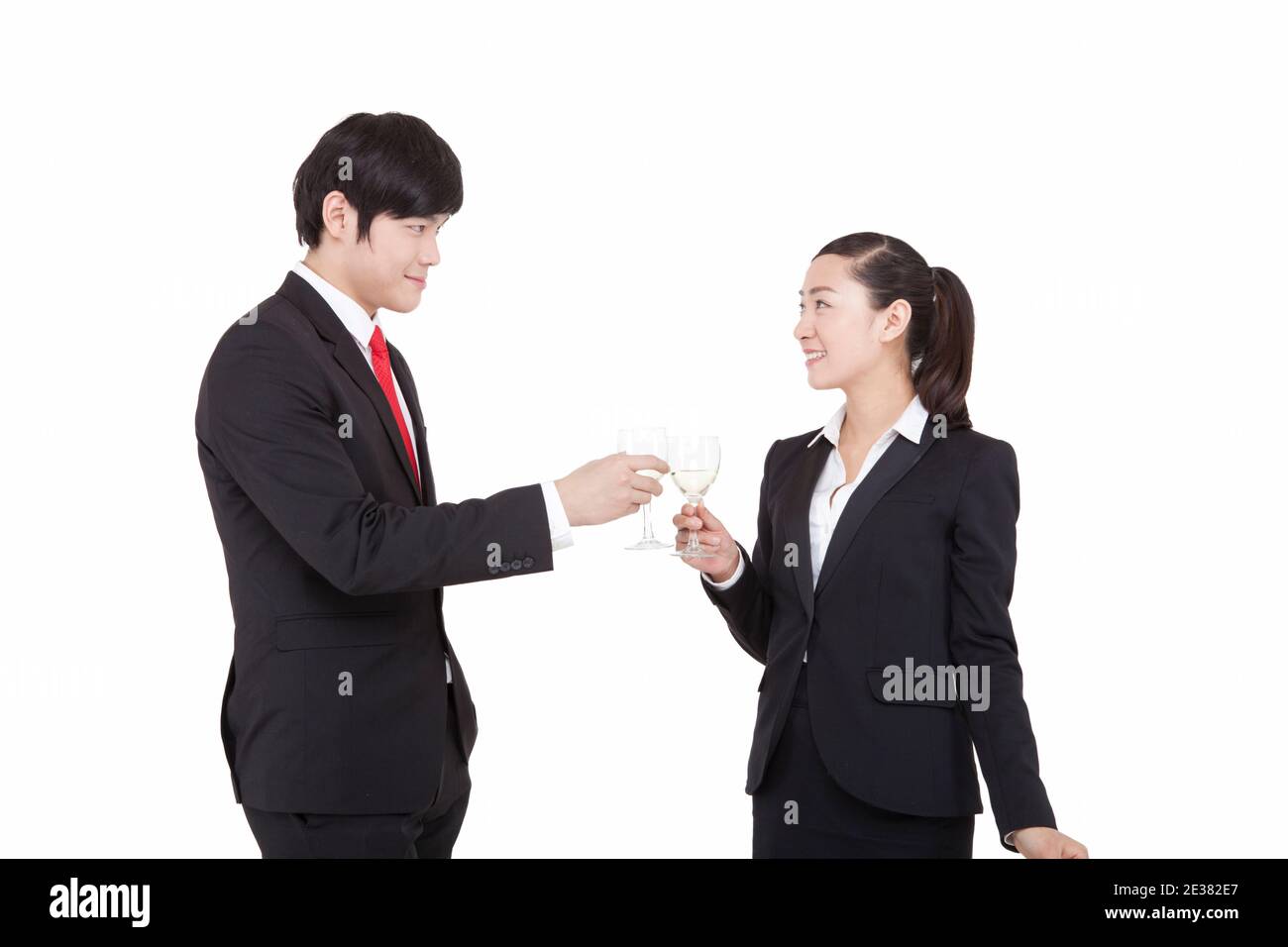 Businessmen toasting celebrating high hi-res stock photography and ...