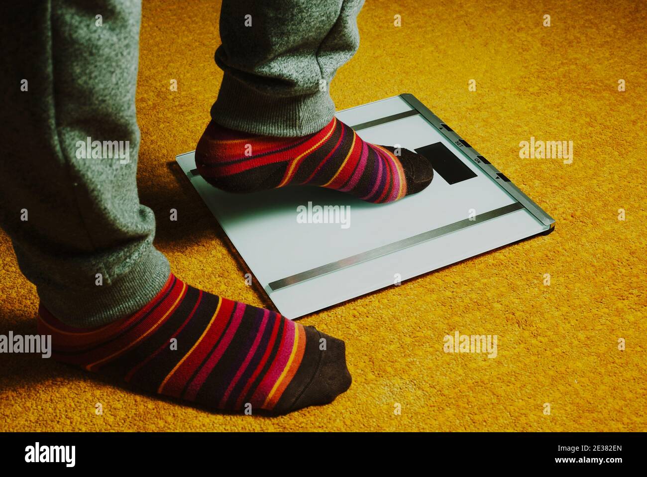 Man on scale feet socks hi-res stock photography and images - Alamy