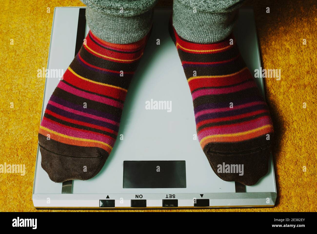 Man on scale feet socks hi-res stock photography and images - Alamy
