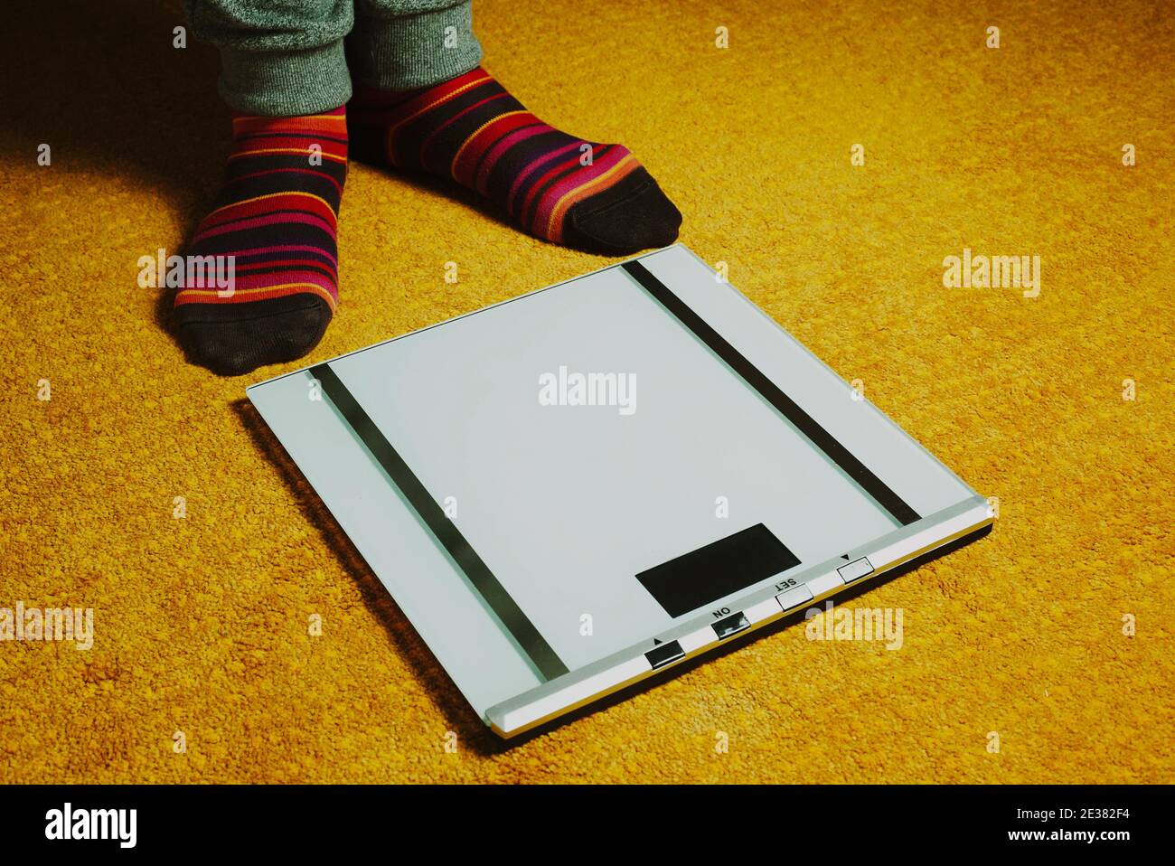 Man on scale feet socks hi-res stock photography and images - Alamy