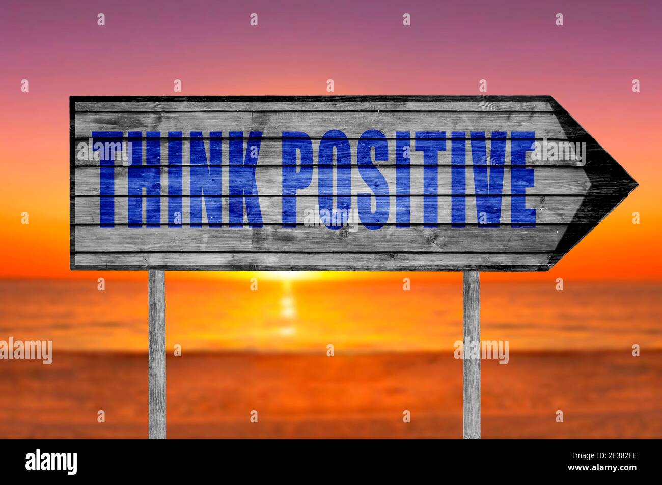 Think Positive wooden sign with on a beach background Stock Photo - Alamy