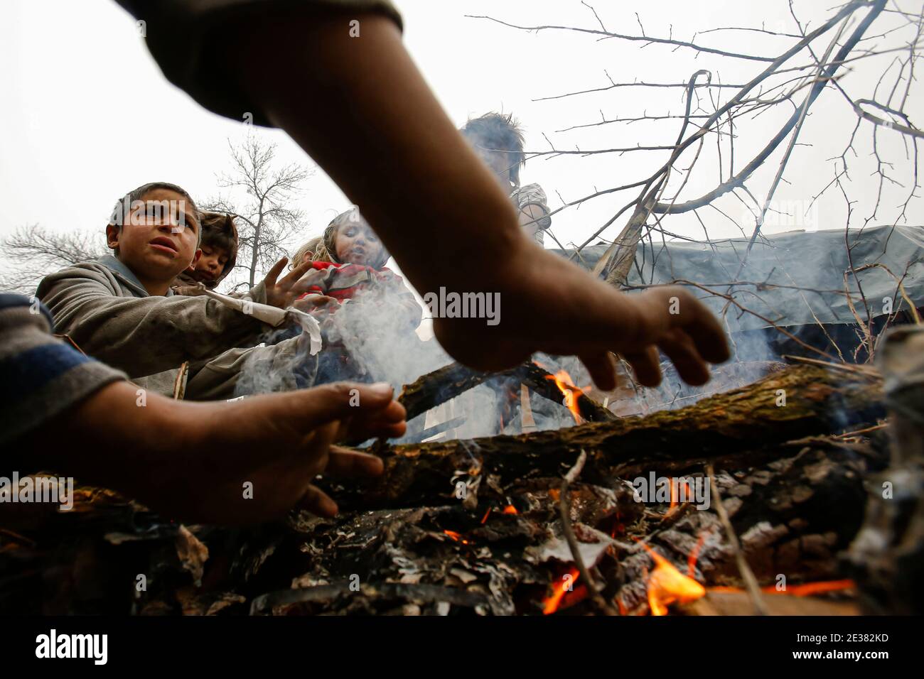 Children winter fire hi-res stock photography and images - Alamy