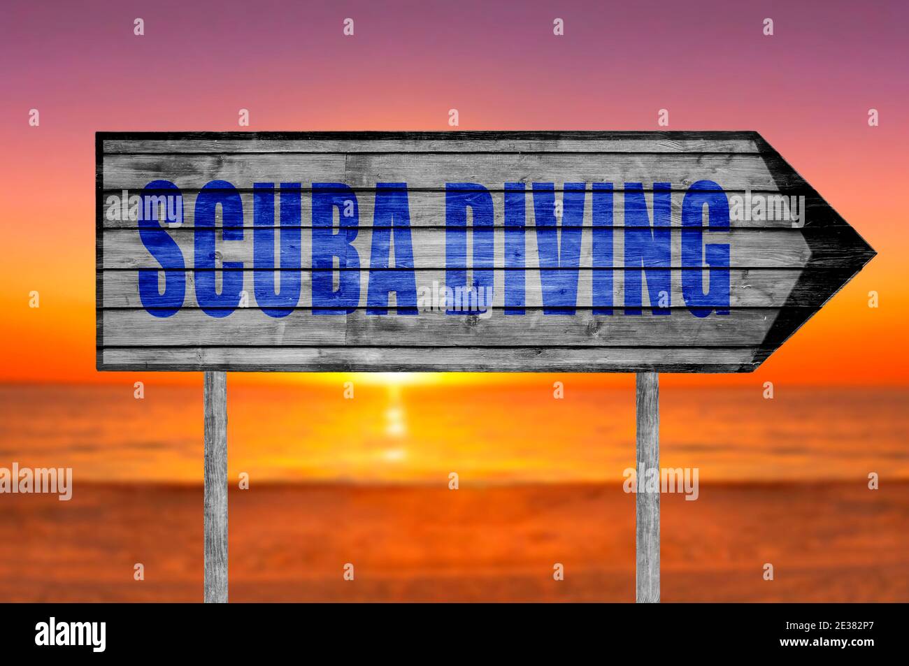 Scuba Diving wooden sign with a beach on background Stock Photo - Alamy