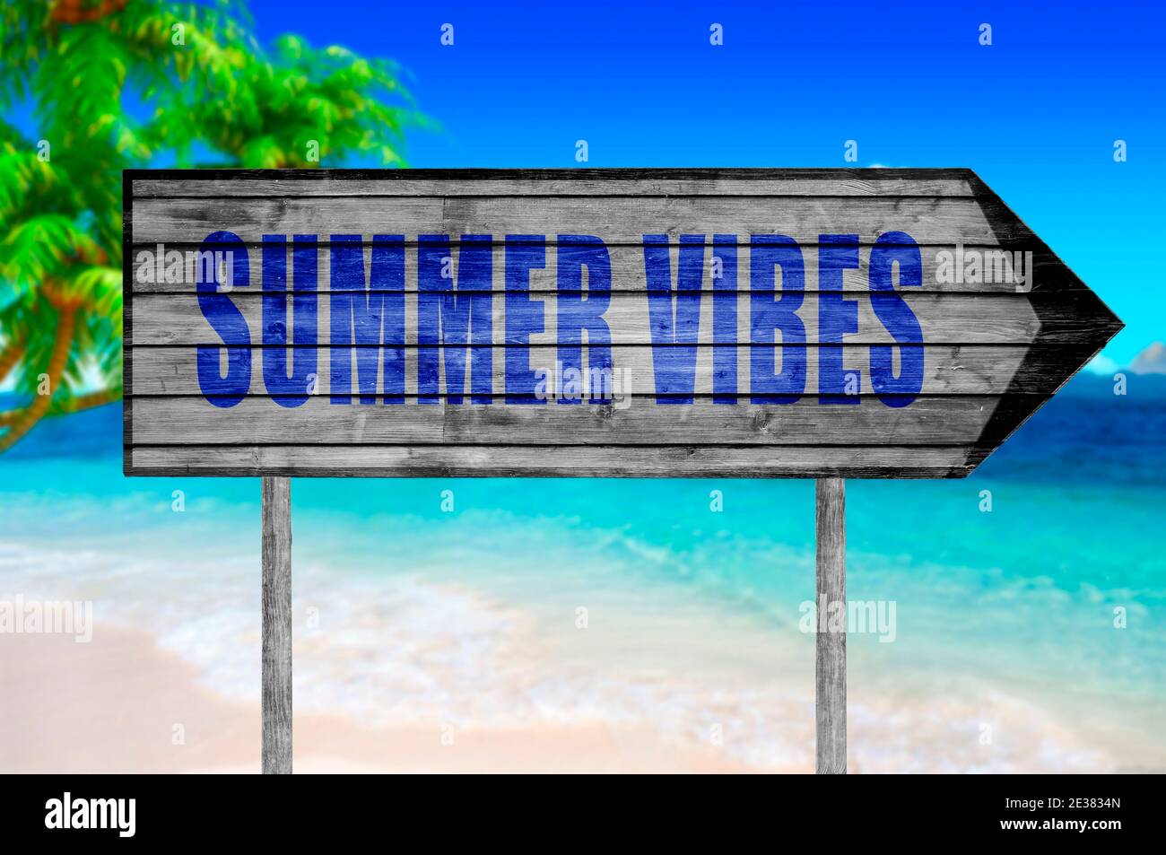 Summer Vibes wooden sign on a beach background Stock Photo - Alamy
